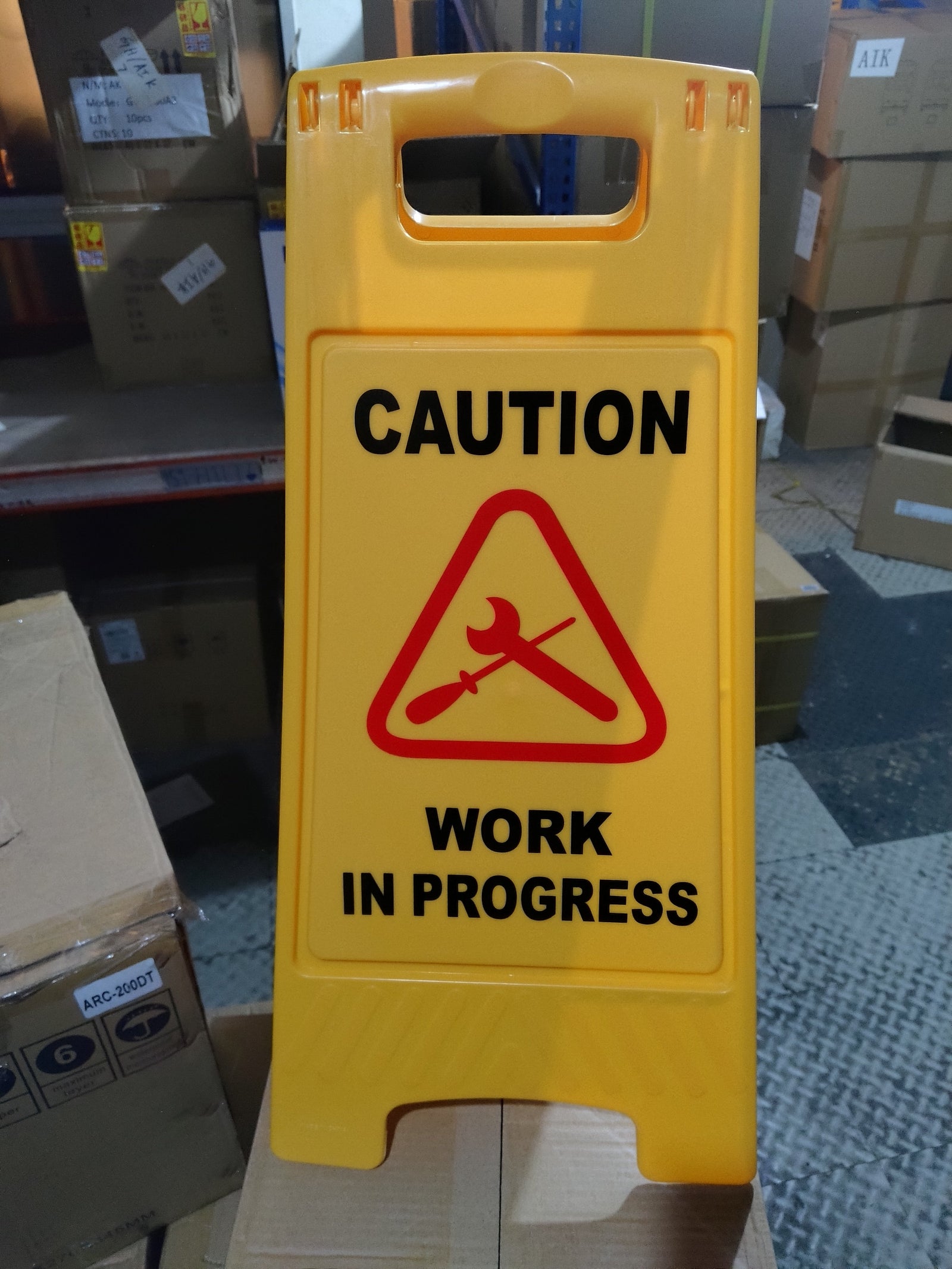Safety Caution Warning A Stand Sign Board "Wet Floor" or "Work In Prog