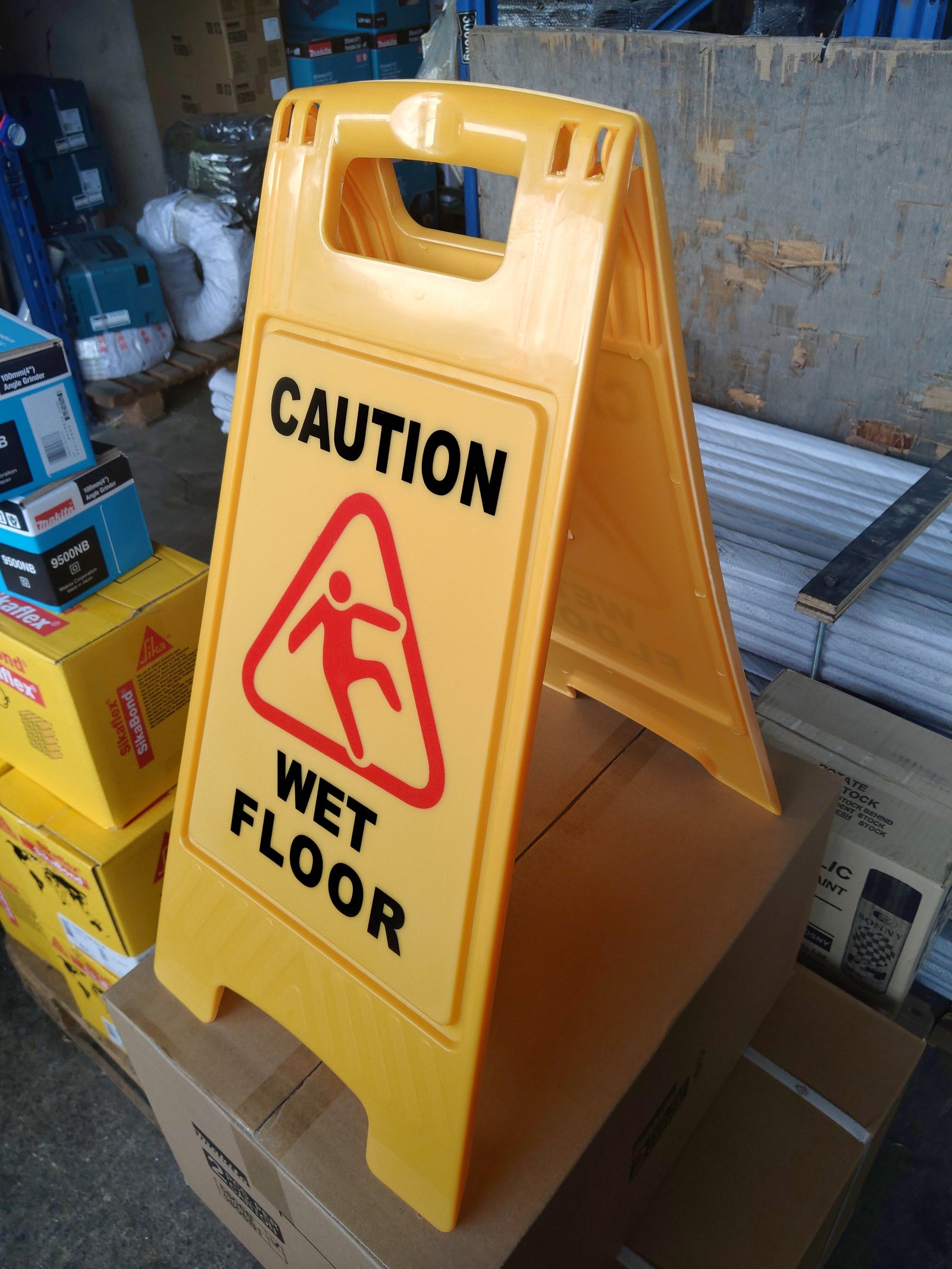 Safety Caution Warning A Stand Sign Board "Wet Floor" or "Work In Prog