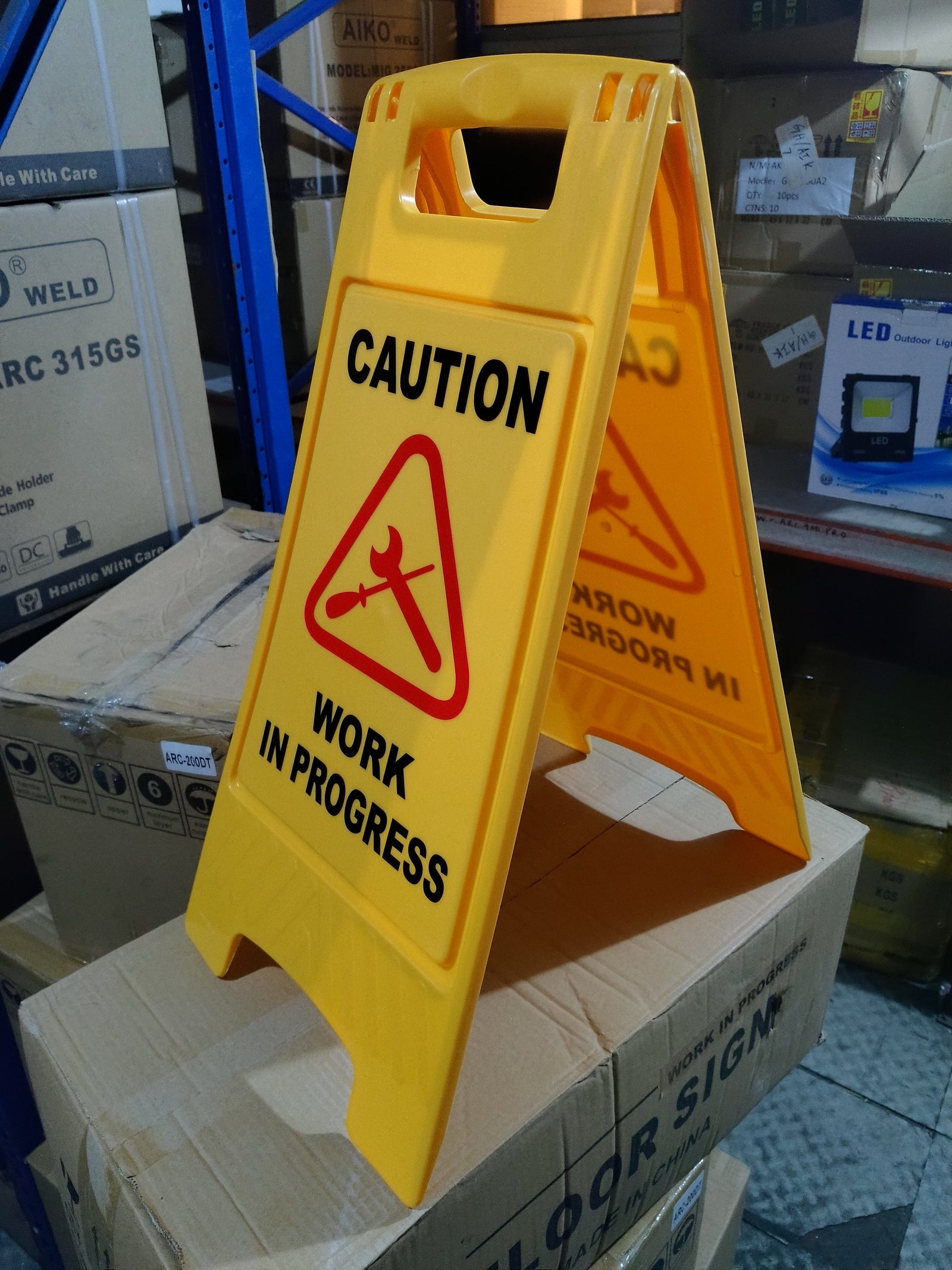 Safety Caution Warning A Stand Sign Board "Wet Floor" or "Work In Prog